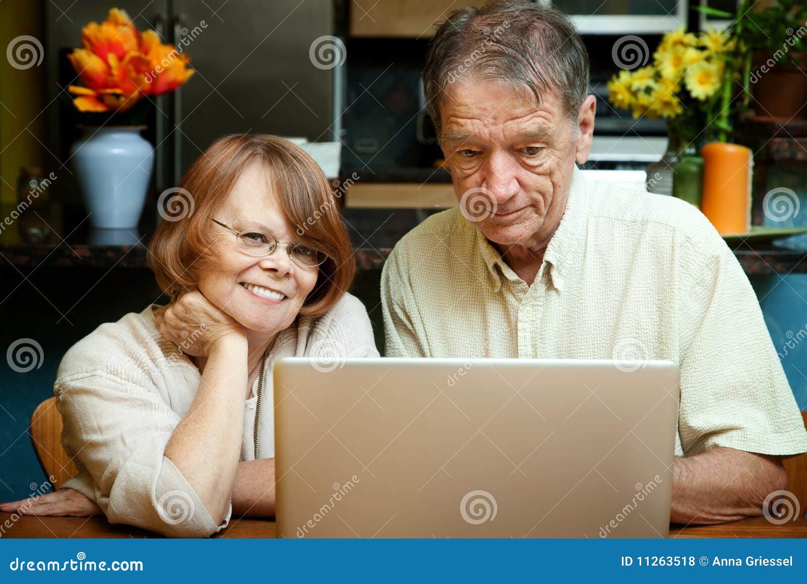 Senior Couple Using Laptop Computer at Home Stock Photo - Image of ...