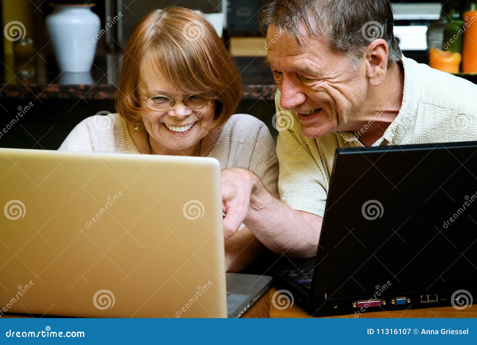 Senior Couple Using Laptop Computers at Home Stock Image - Image of ...