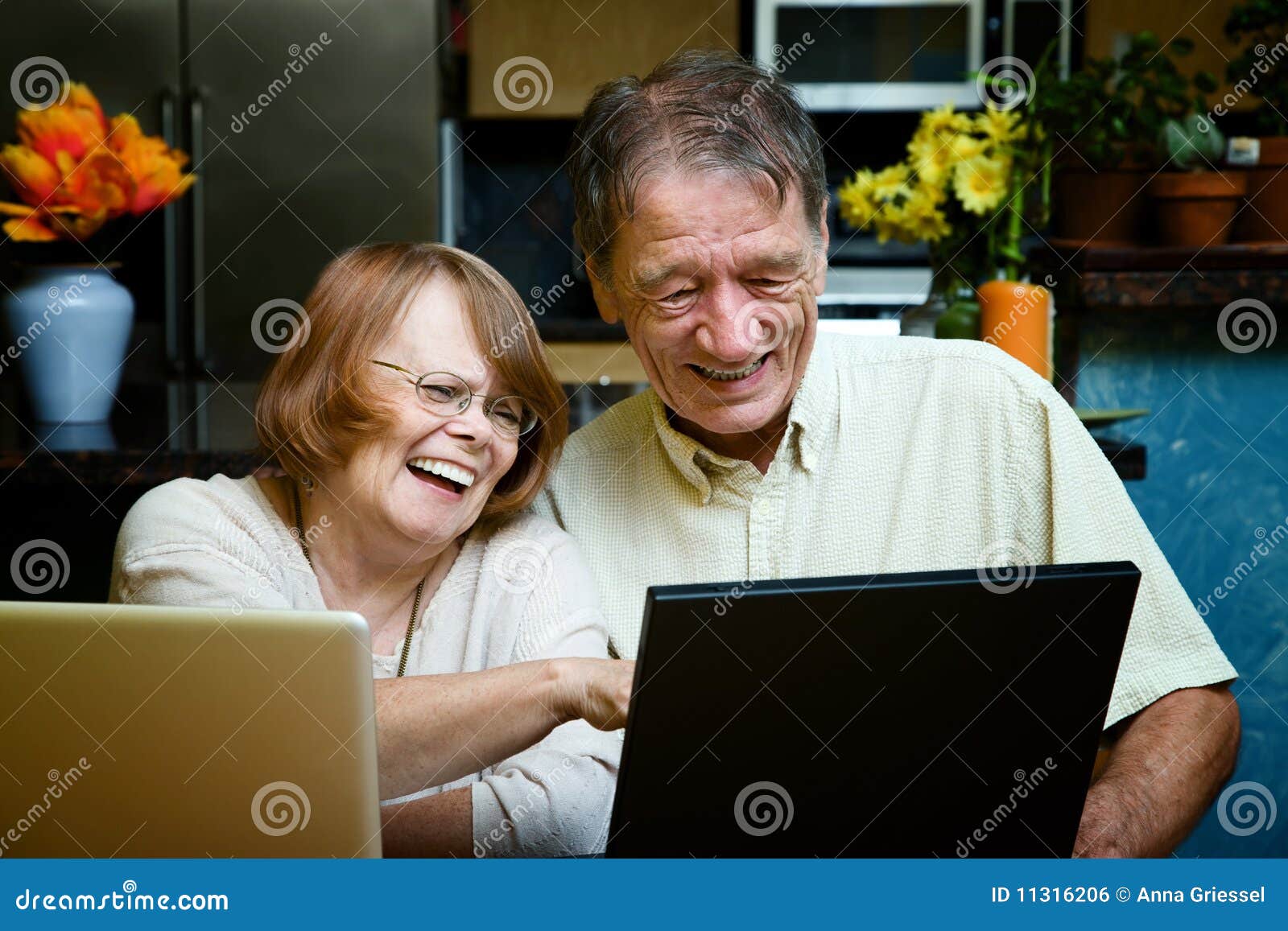 Senior Couple Using Laptop Computers at Home Stock Photo - Image of ...