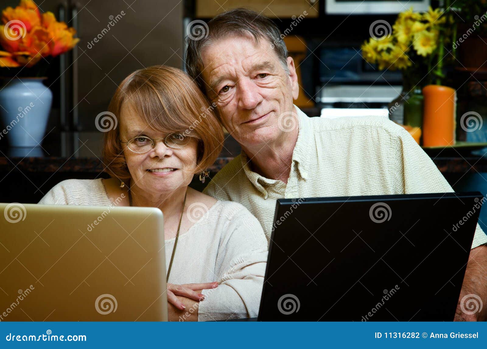 Senior Couple Using Laptop Computers at Home Stock Photo - Image of ...
