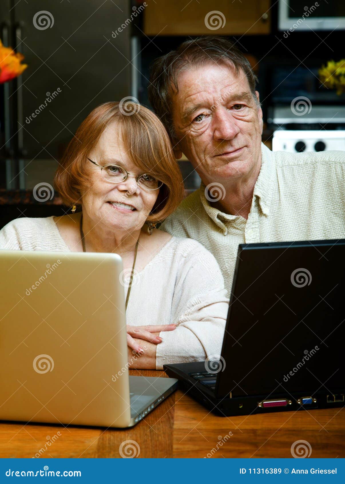 Senior Couple Using Laptop Computers at Home Stock Image - Image of ...