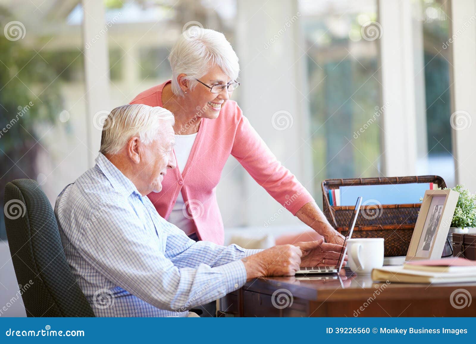Senior Couple Using Laptop on Desk at Home Stock Photo - Image of ...