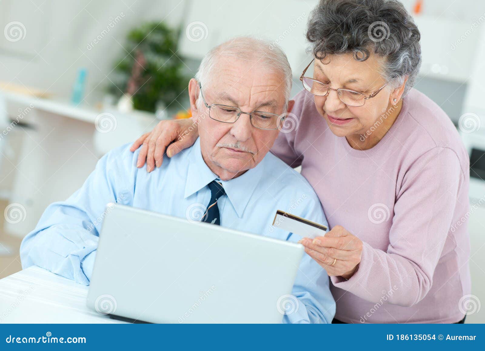 Senior Couple Using Notebook at Home Stock Photo - Image of married ...