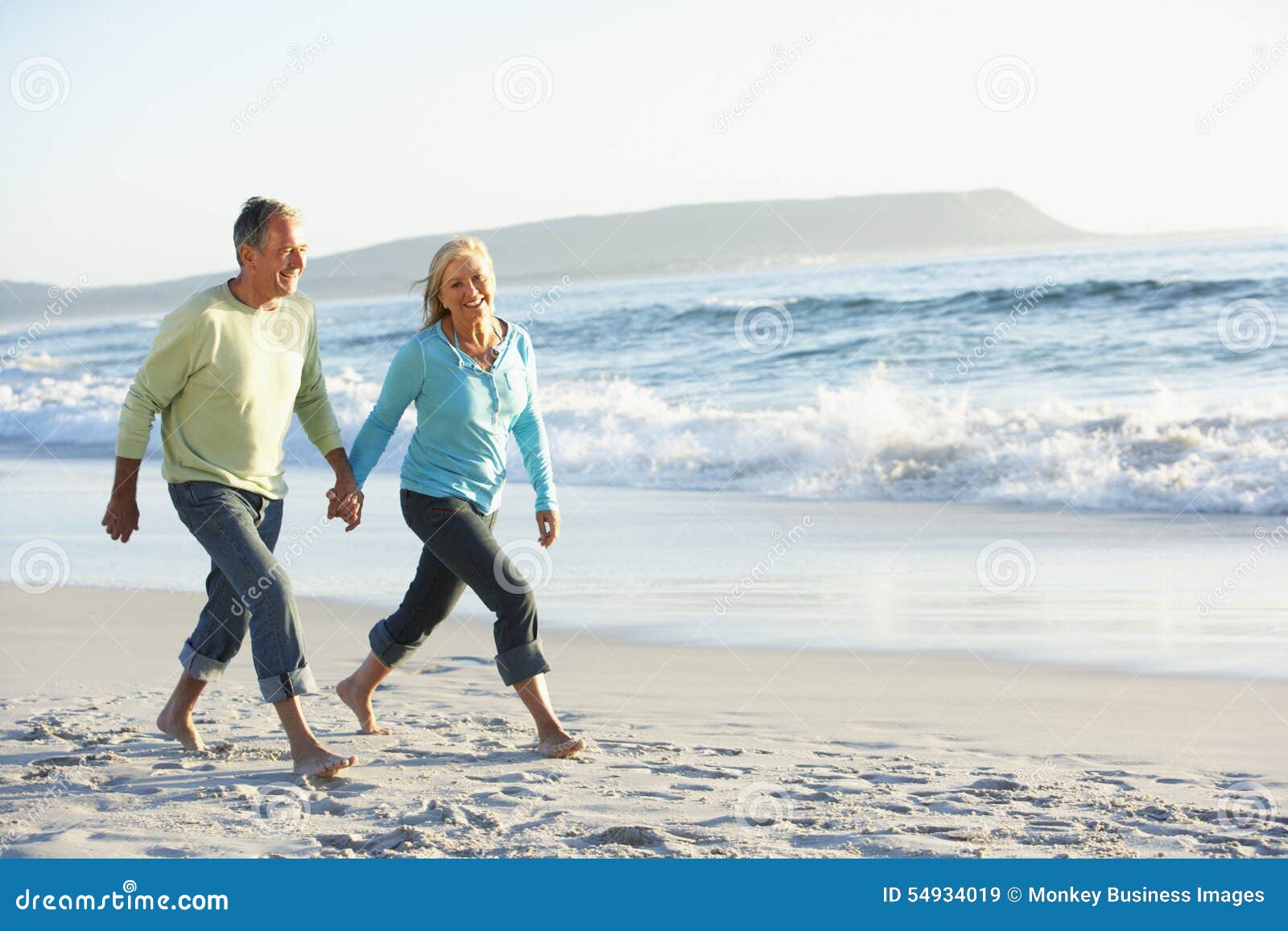 Senior Couple Walking Along Beach Stock Image - Image of hand, enjoying ...