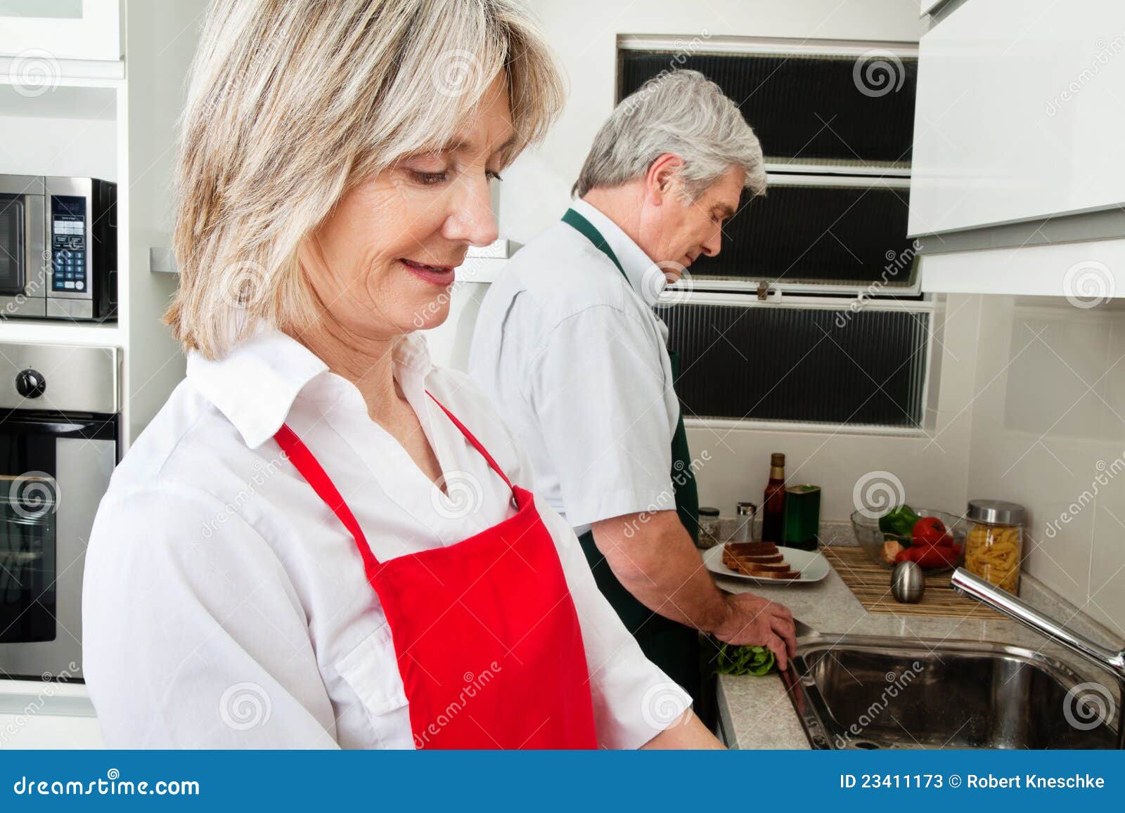 Senior Couple Working in Kitchen Stock Image - Image of help, groceries ...