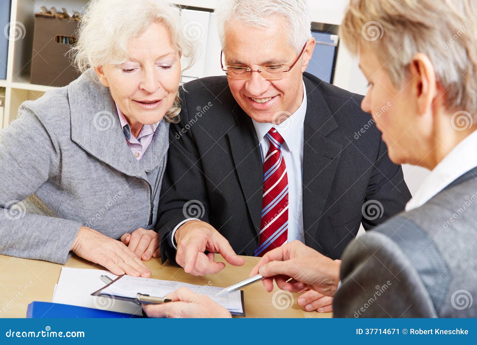 Senior Couple Writing Signature Stock Image - Image of customers ...