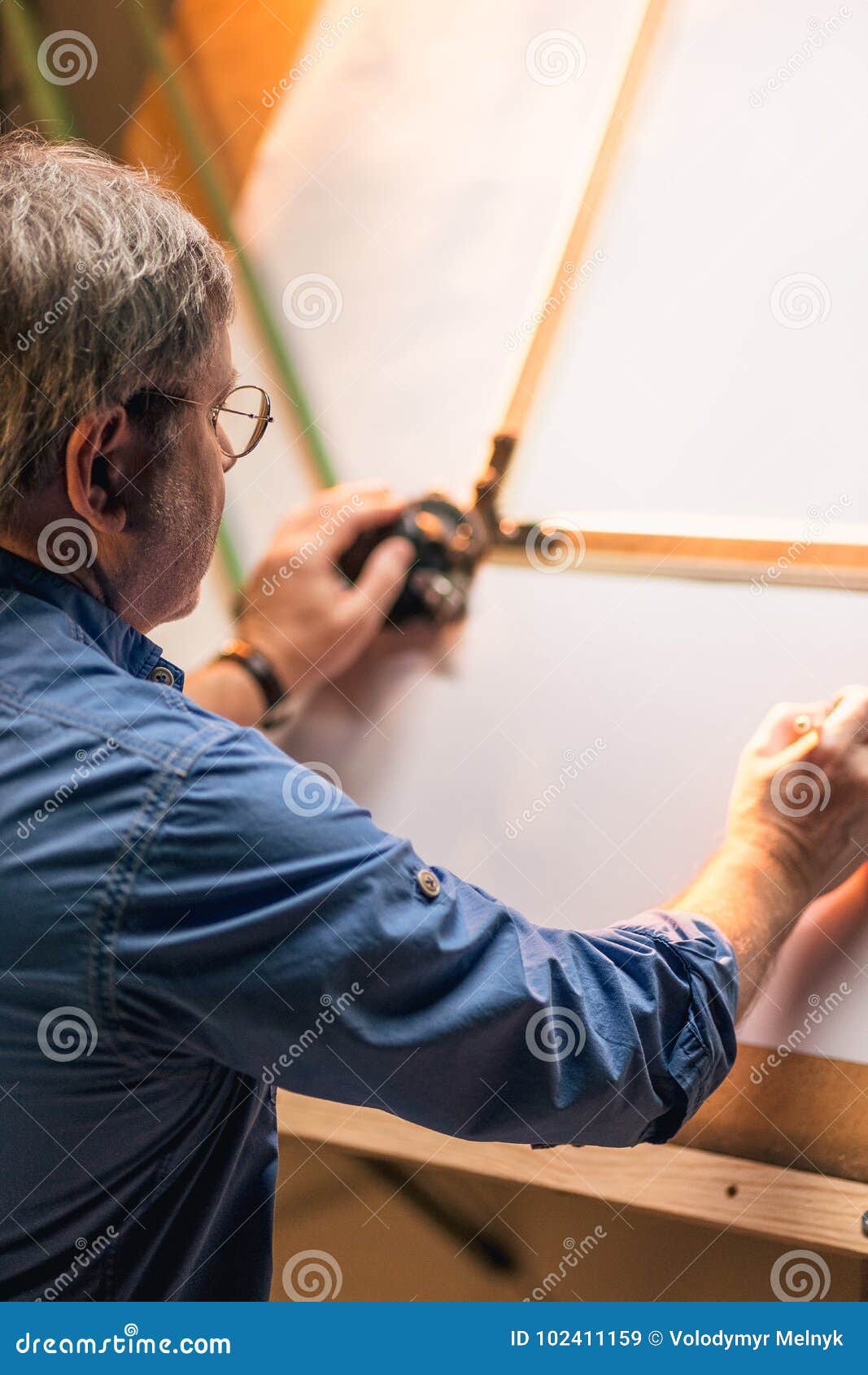 The Mature Creative Engineer Working with Project on Drawing Board ...