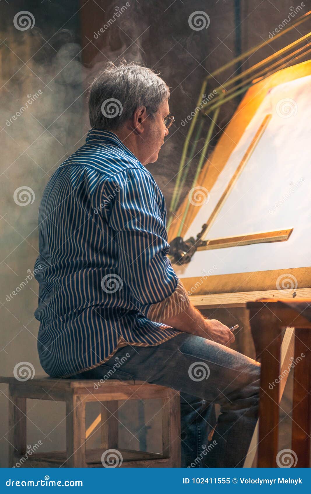 The Mature Creative Engineer Working with Project on Drawing Board ...