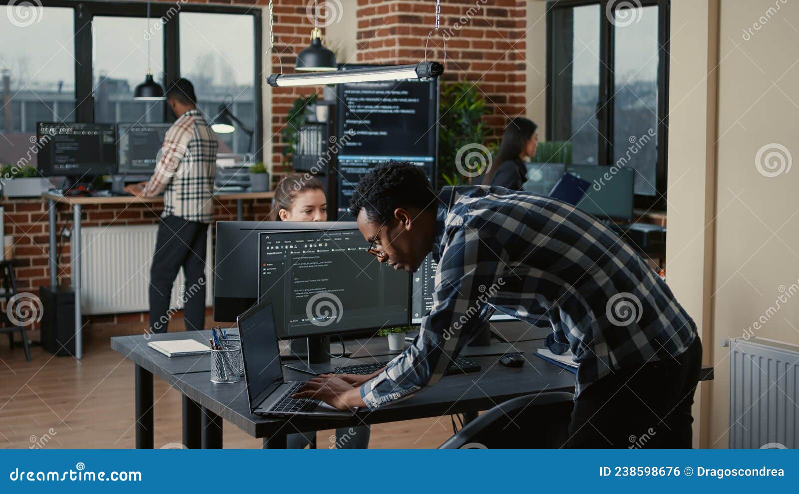 Senior Developer Coding on Laptop at Desk with Computer Screens Parsing Code Stock Photo - Image ...