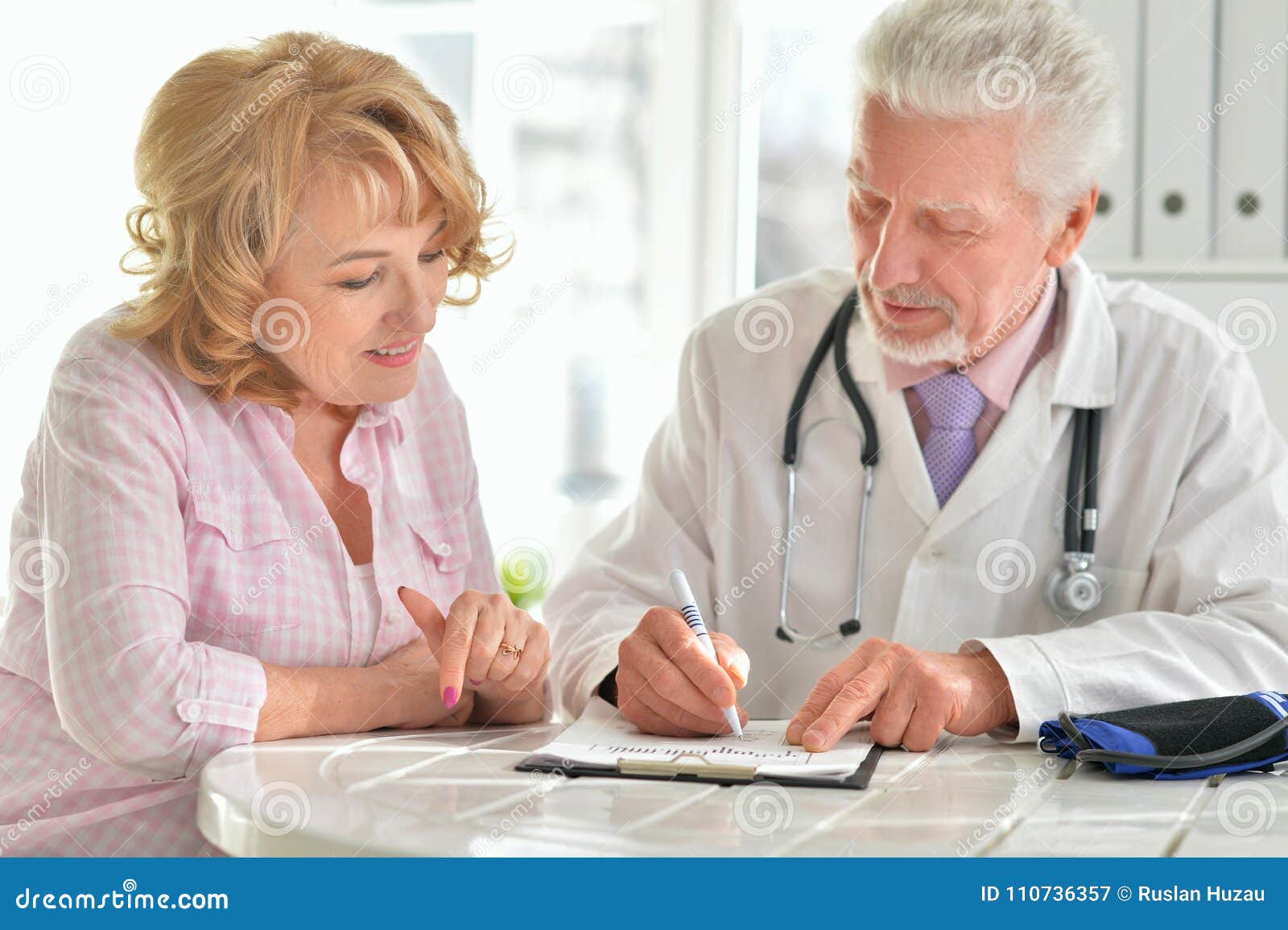 Senior Doctor with Elderly Patient Stock Image - Image of equipment ...