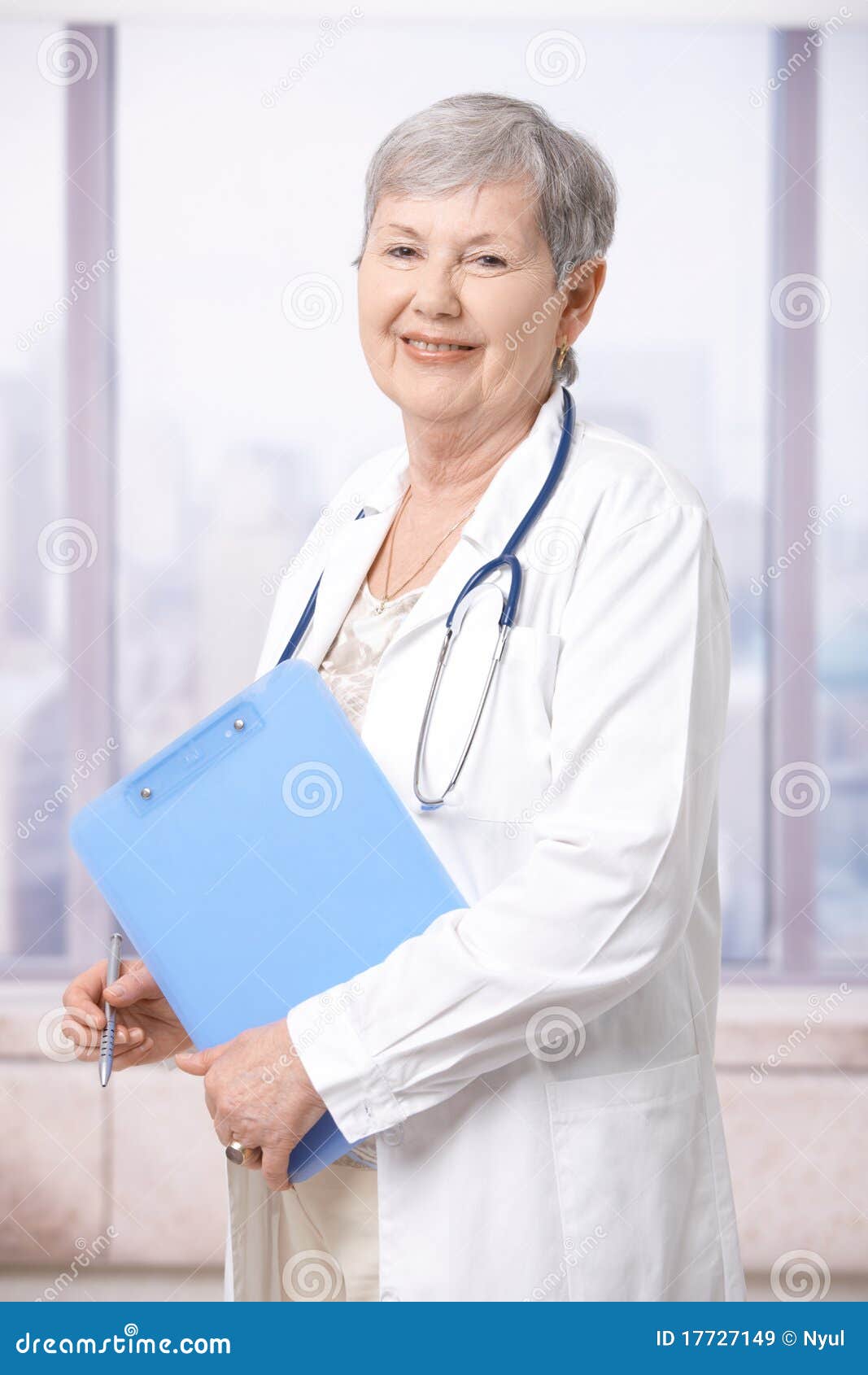 Senior Doctor Holding Notepad Stock Image - Image of doctor, expertise ...