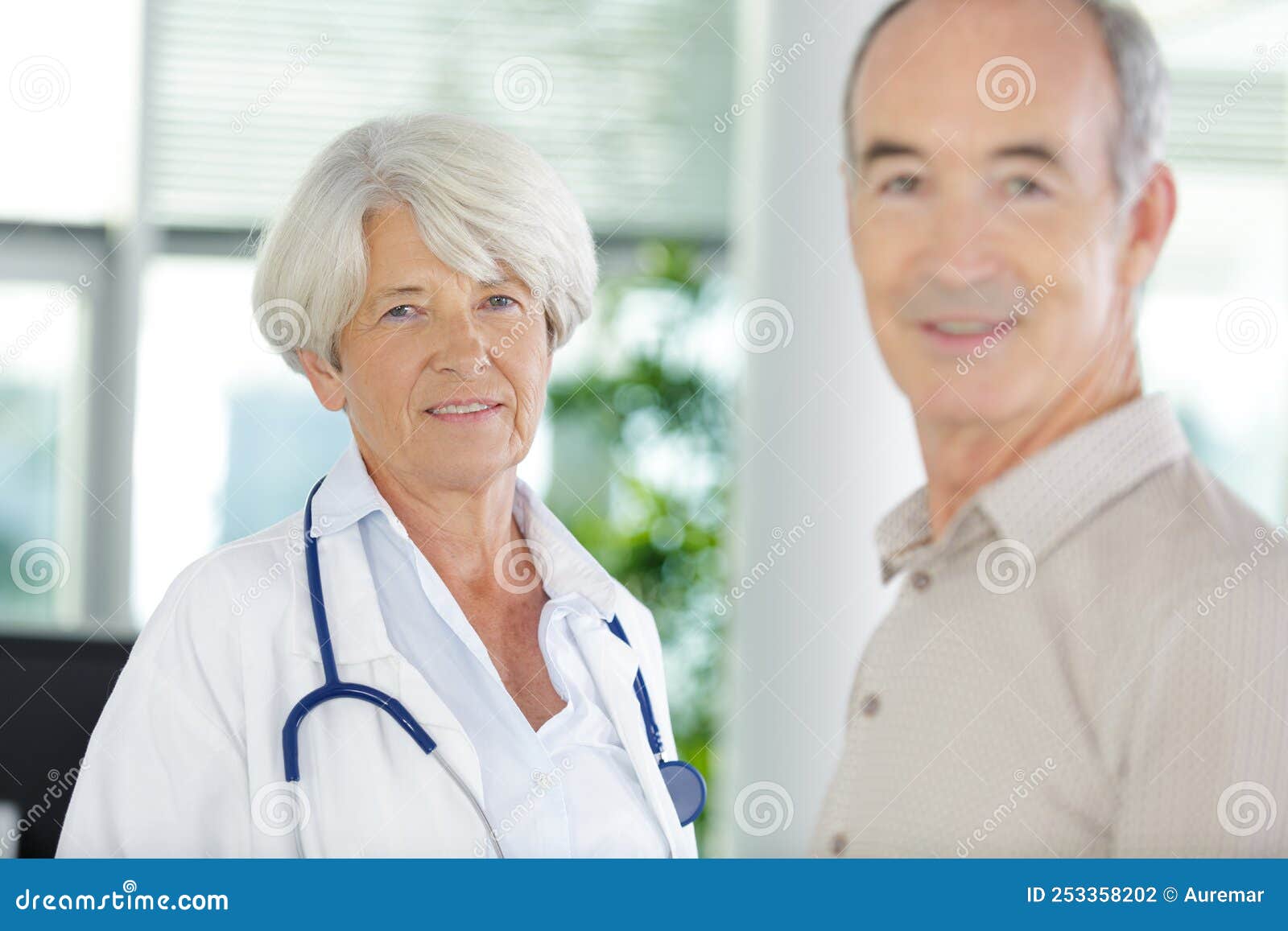 Senior Doctor and Patient Looking at Camera Stock Photo - Image of ...