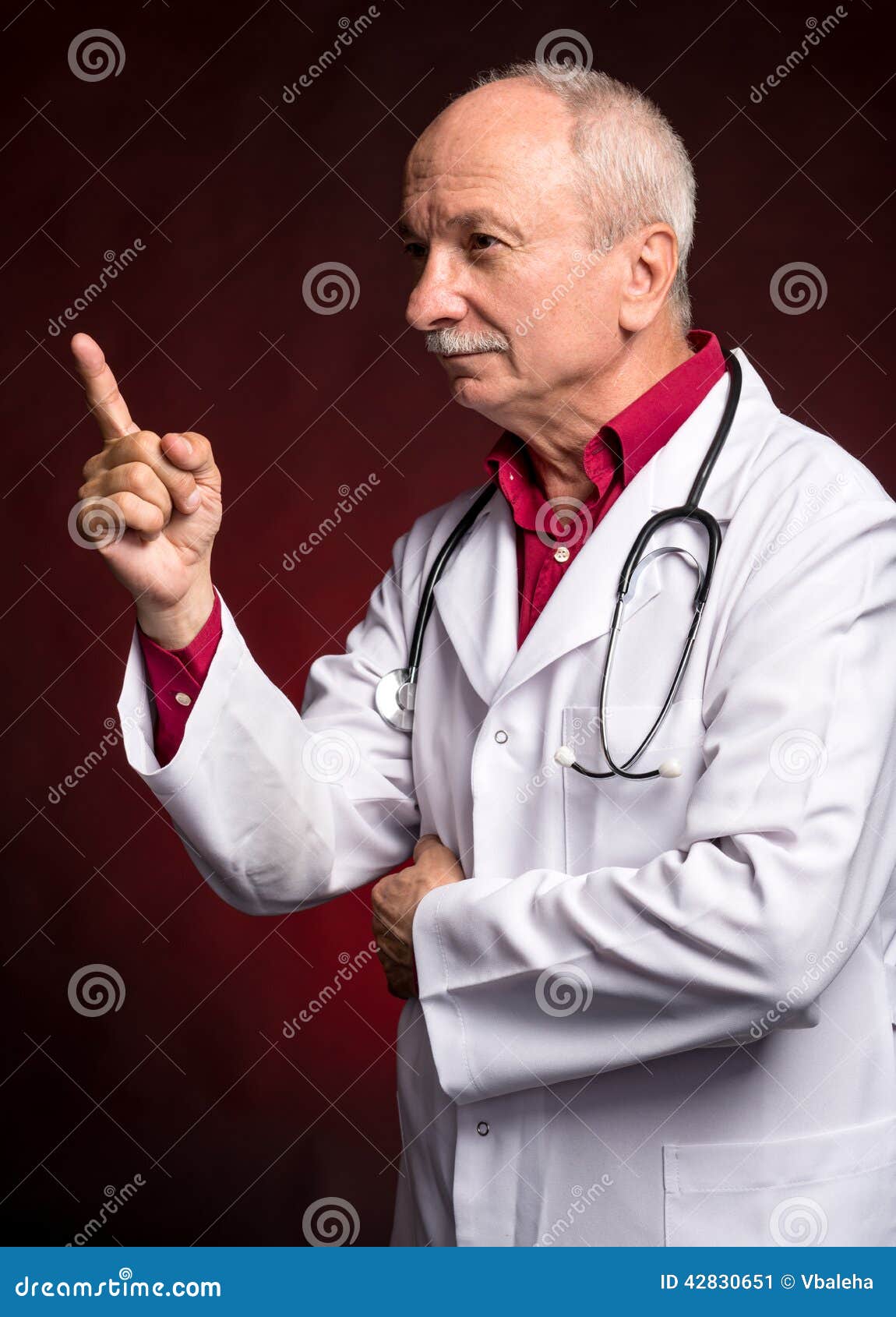 Senior Doctor Pointing Upwards Stock Image - Image of healthcare ...