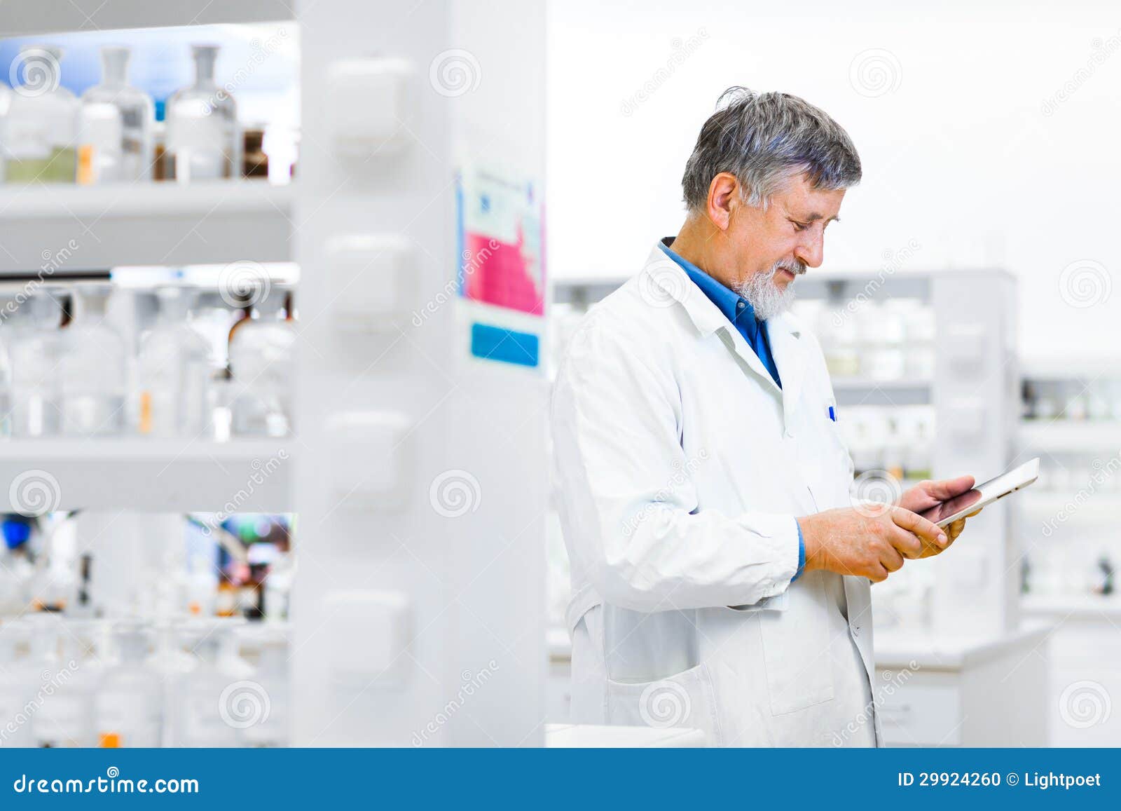 Senior Doctor/scientist Using His Tablet Computer at Work Stock Photo ...