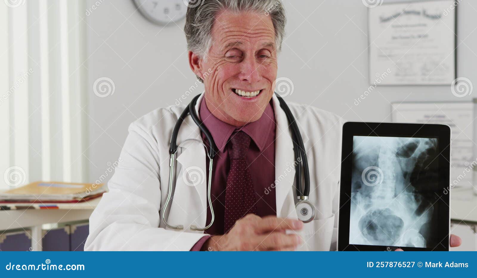 Senior Doctor Talking To Camera with Xray Stock Video - Video of talk ...