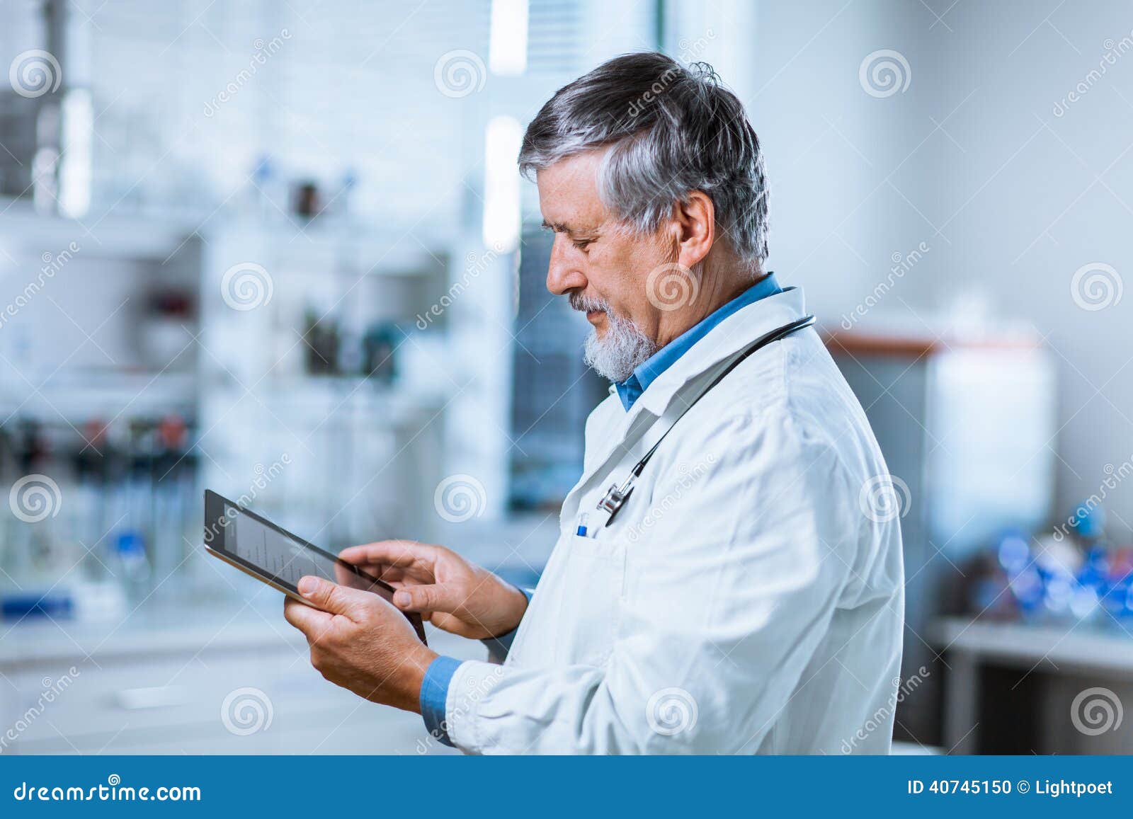 Senior Doctor Using His Tablet Computer at Work Stock Photo - Image of ...