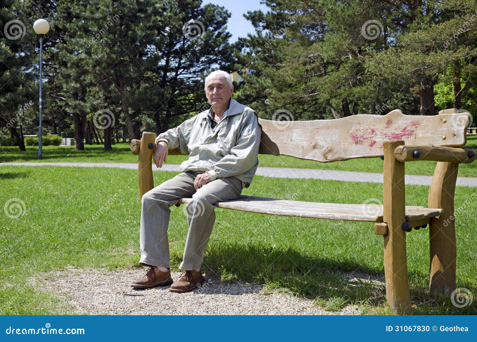 Senior dozing on bench stock photo. Image of senior, grass - 31067830