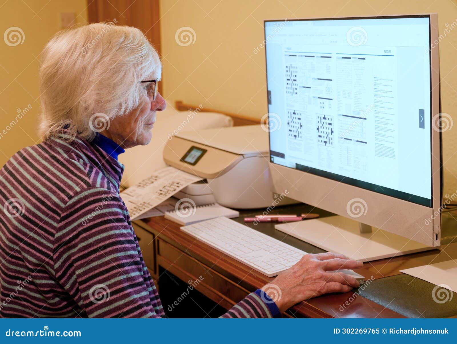 Senior Elderly Lady S Using Computer To Play Online Puzzles Stock Image ...