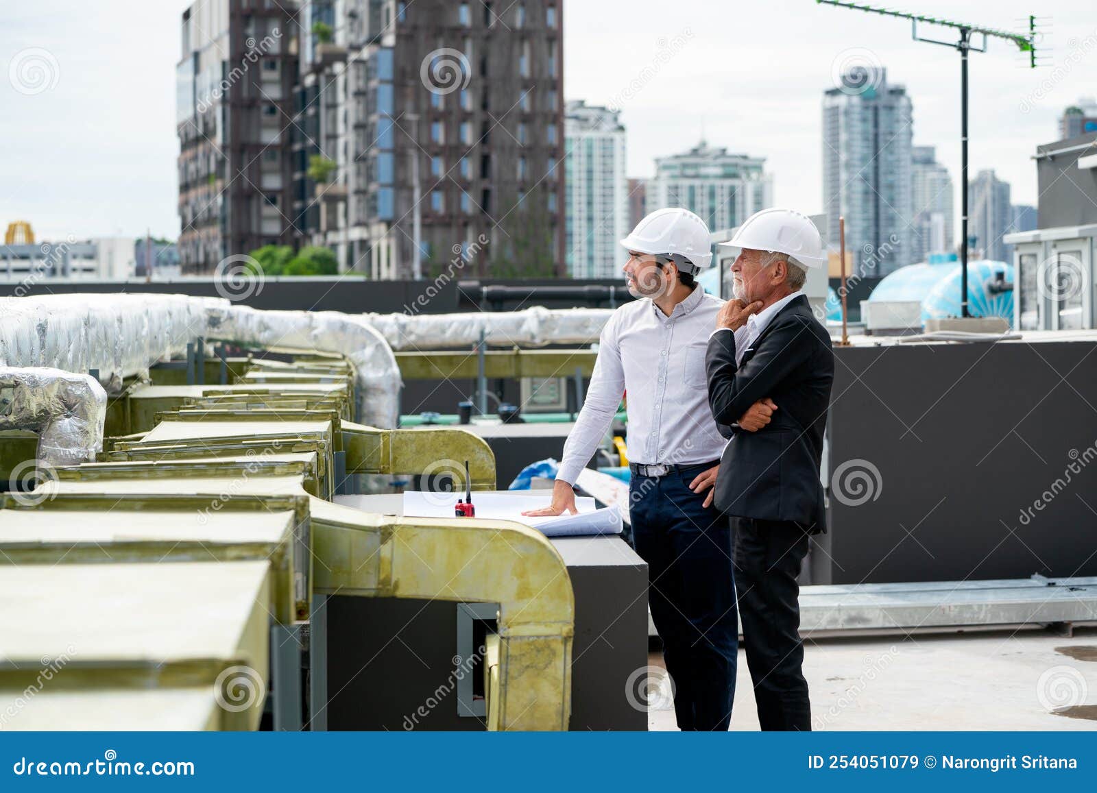 Senior Engineer Man Stand with Action of Thinking and Work with Young ...