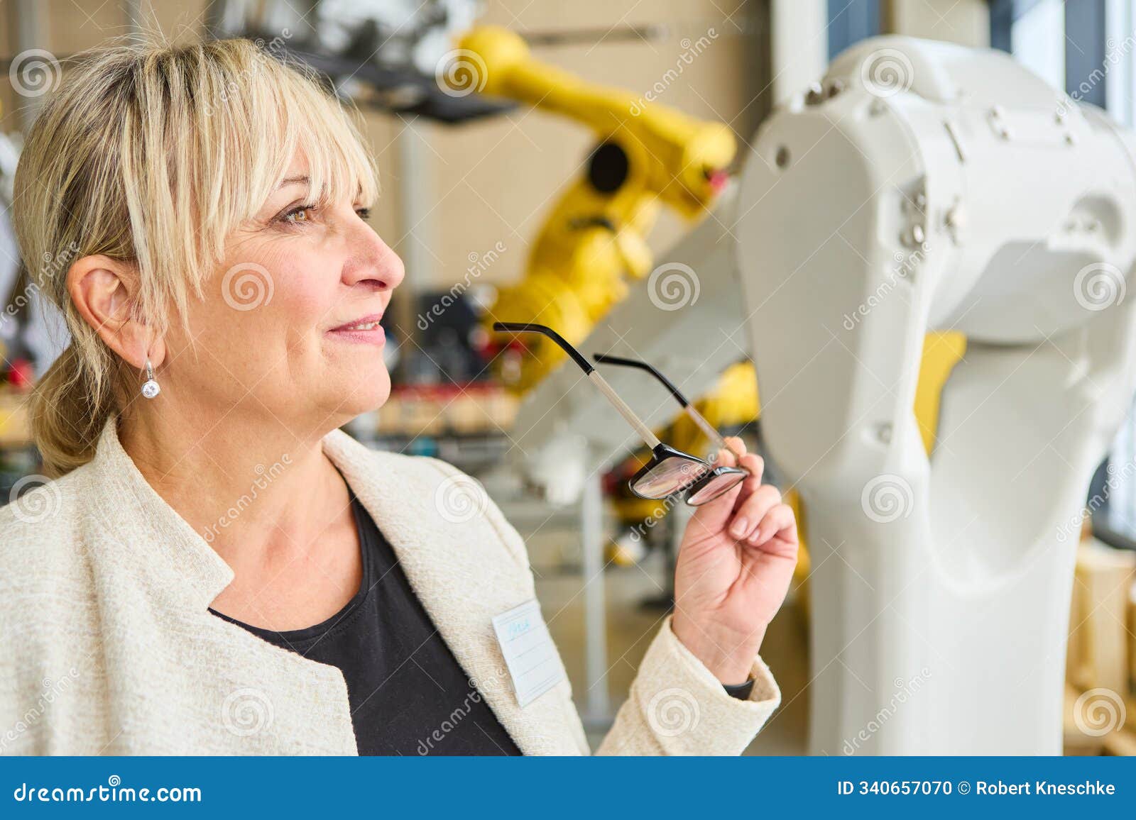 Senior Engineer Observing Robotics Development in an Industrial Setting ...