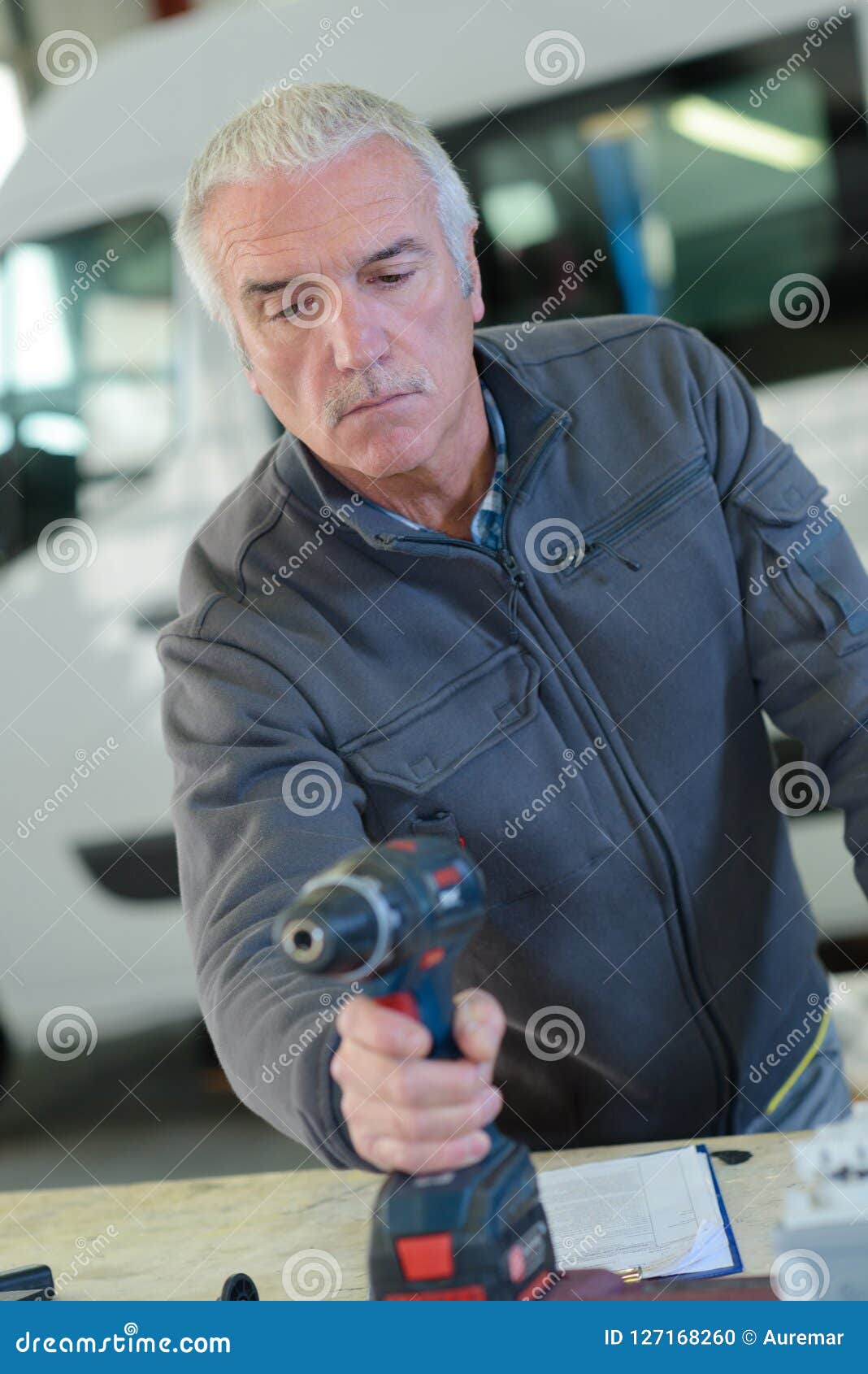 Senior Engineer Using Drill in Factory Stock Photo - Image of industry ...