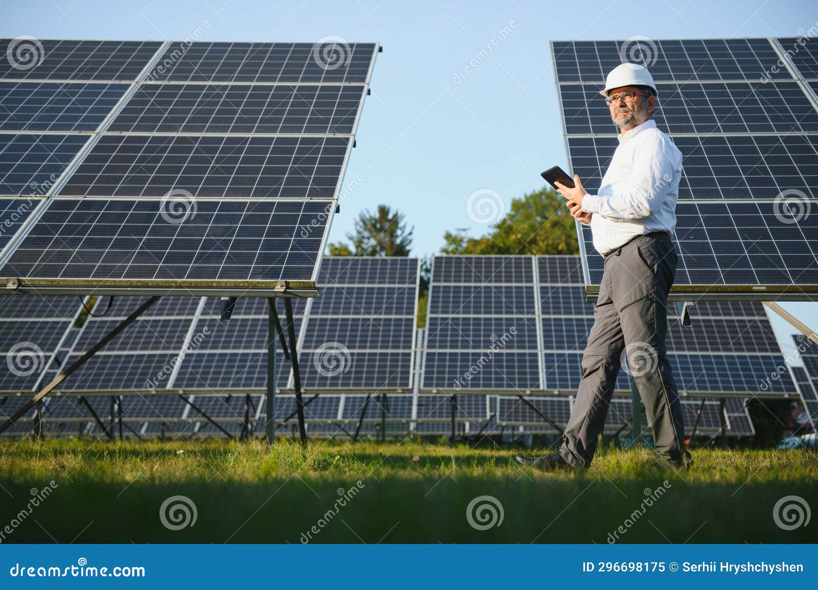 Senior Engineer Working on Solar Panel Farm. the Concept of Green ...