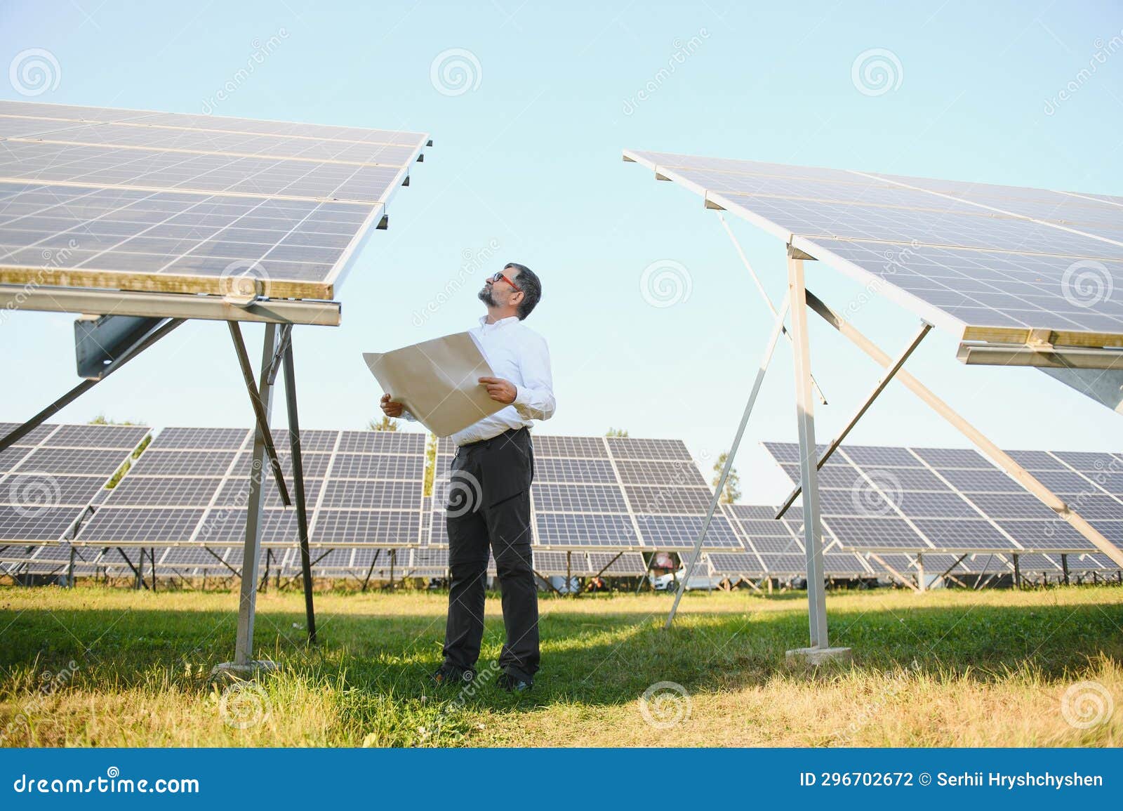 Senior Engineer Working on Solar Panel Farm. the Concept of Green ...