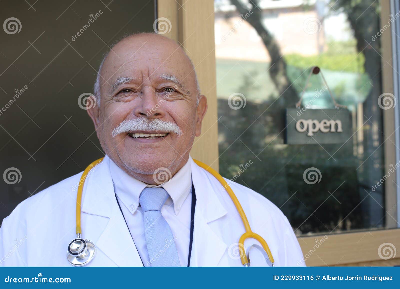 Bald Doctor By A Door With Tense Face Expression. Royalty-Free Stock ...