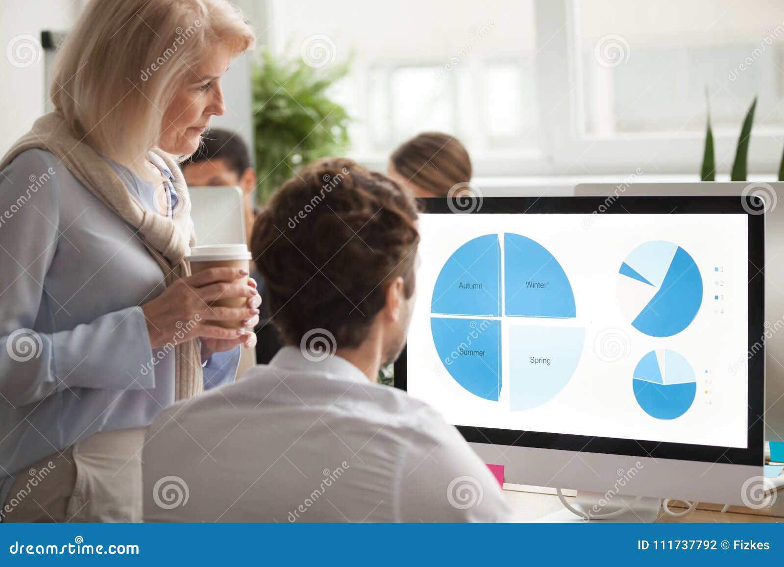 Senior Executive Checking Annual Report on Computer Screen Helpi Stock ...