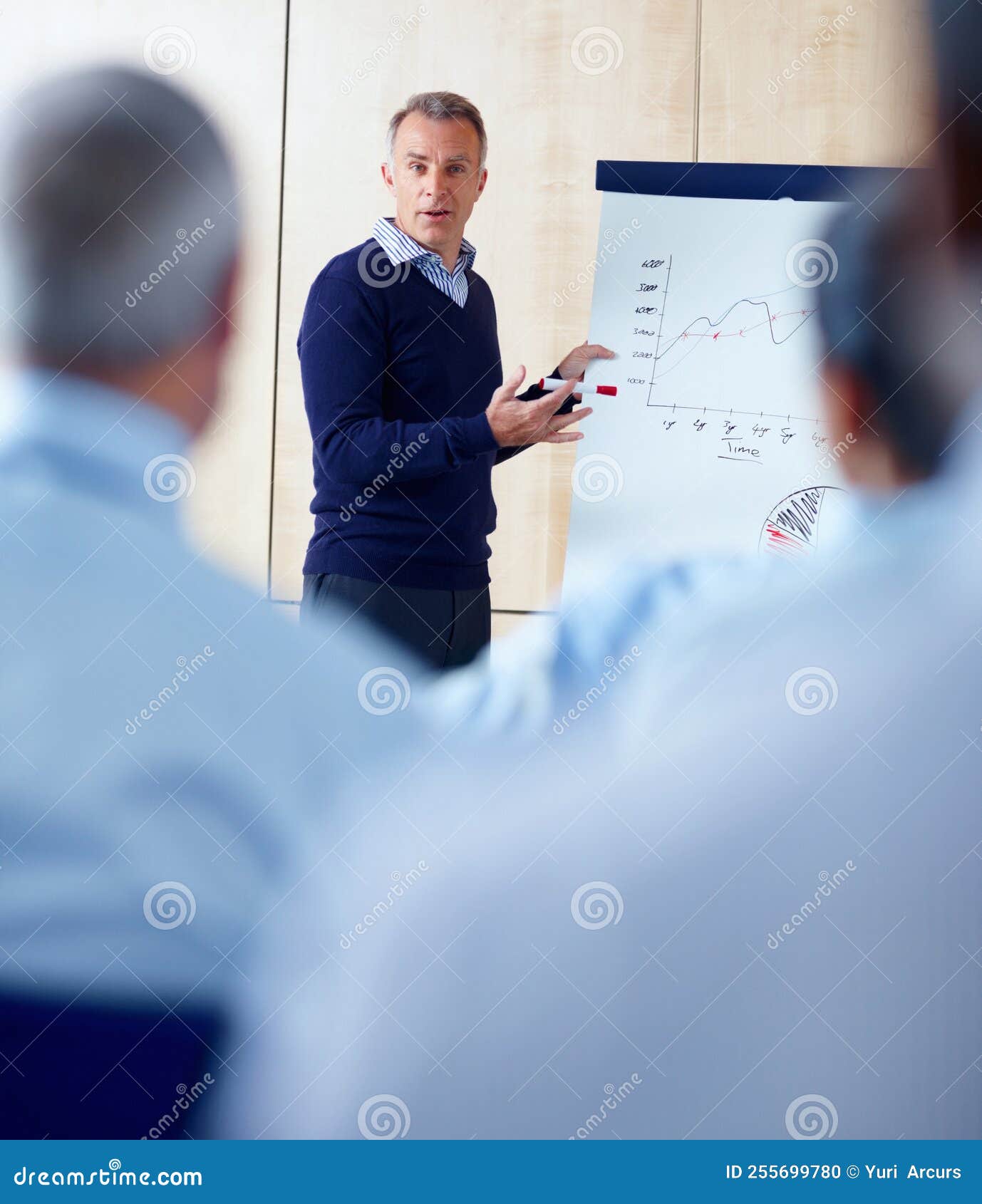 Senior Executive Giving Presentation To Group. Senior Man at Front of ...