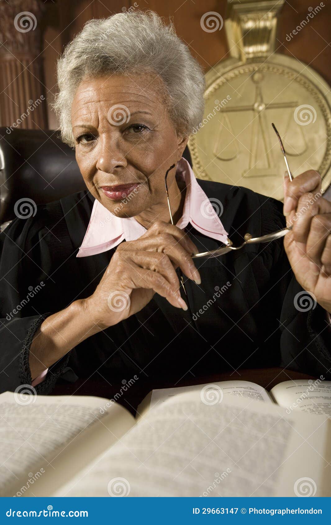 Senior Female Judge Sitting with Books Stock Image - Image of judge ...