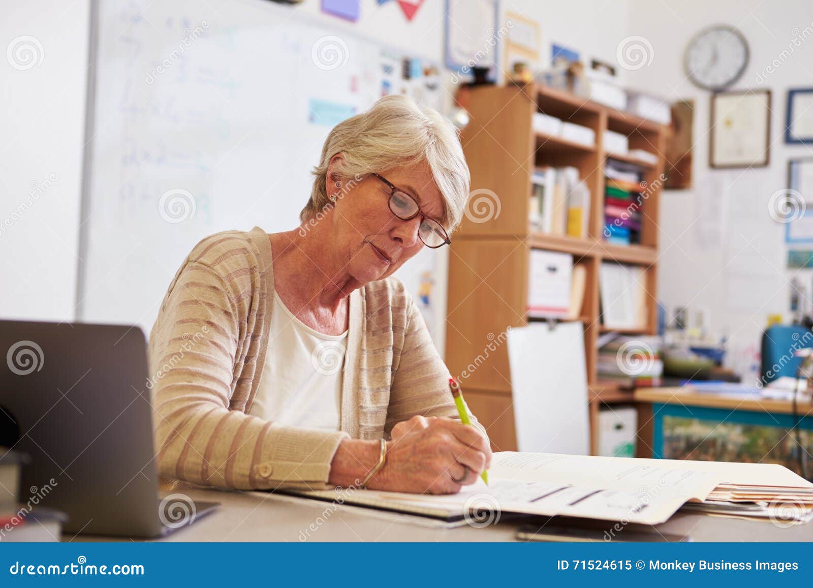 Female Teacher Looks At The Chemical Reaction Of A Reagent In A Glass ...