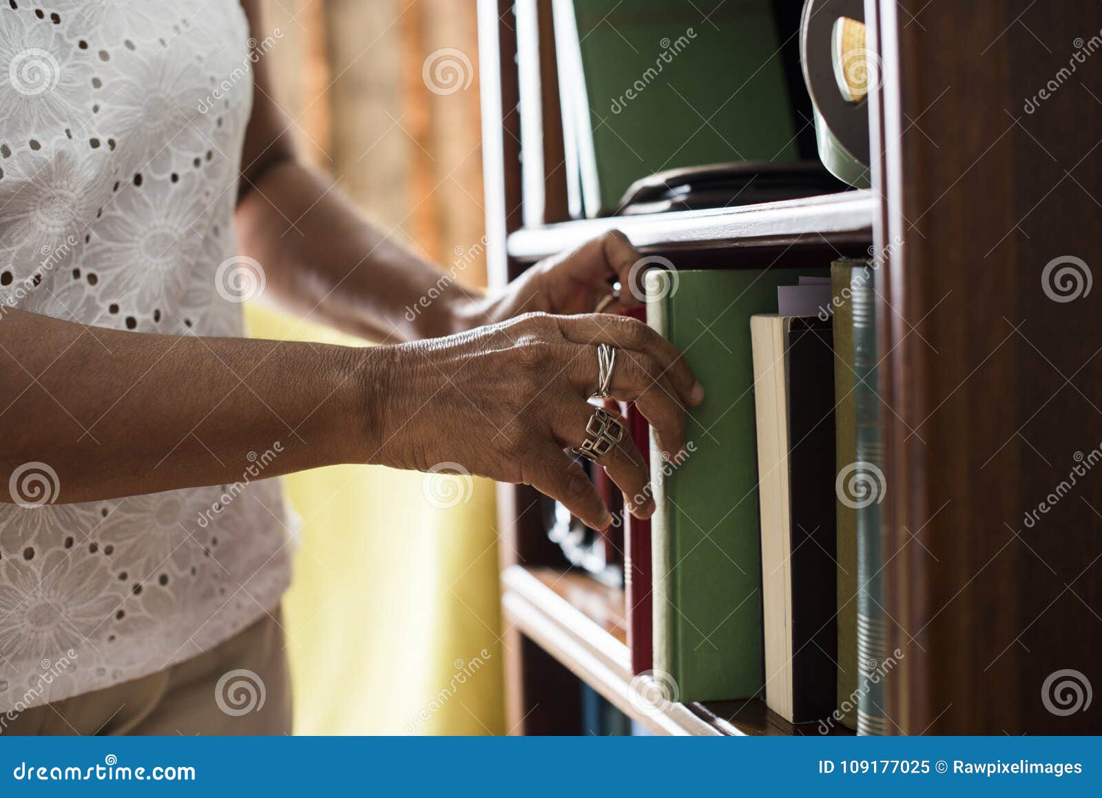 Senior Finding a Book from the Bookshelf Stock Image - Image of retired ...