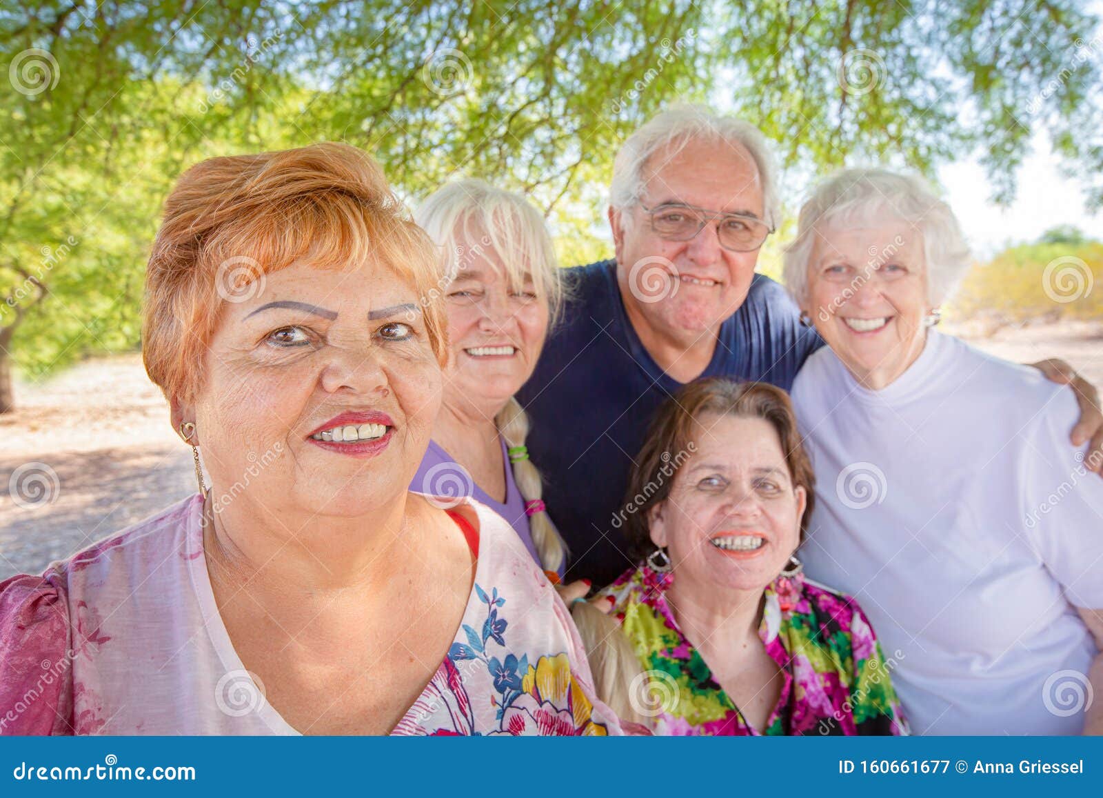 Senior Friends Standing Outdoors Under a Tree Stock Image - Image of ...