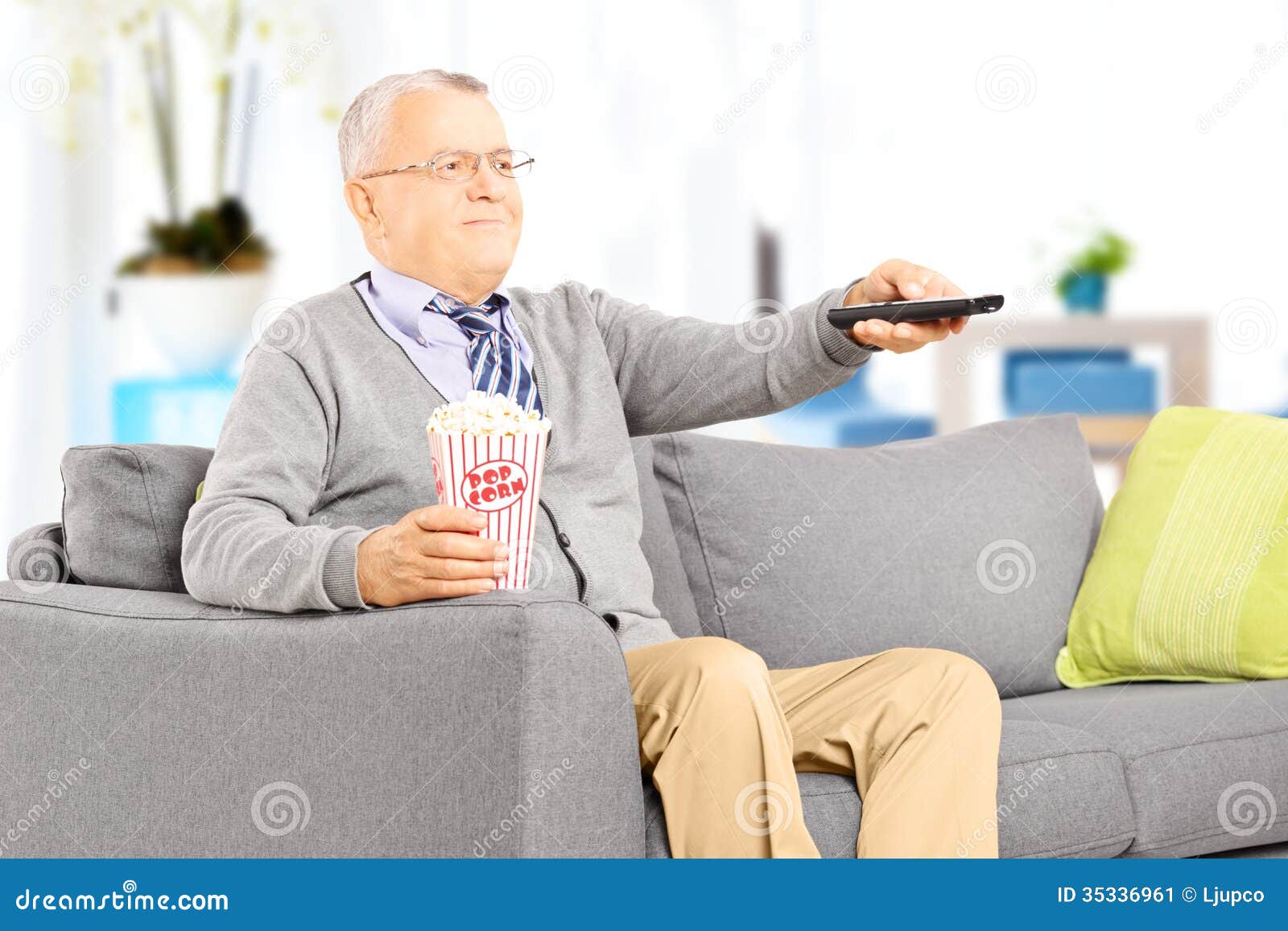 Senior Gentleman on a Sofa and Watching TV Stock Image - Image of ...