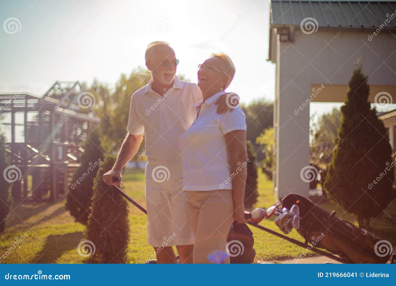 Golfers on Golf Course in Hug Stock Image - Image of cheerful ...