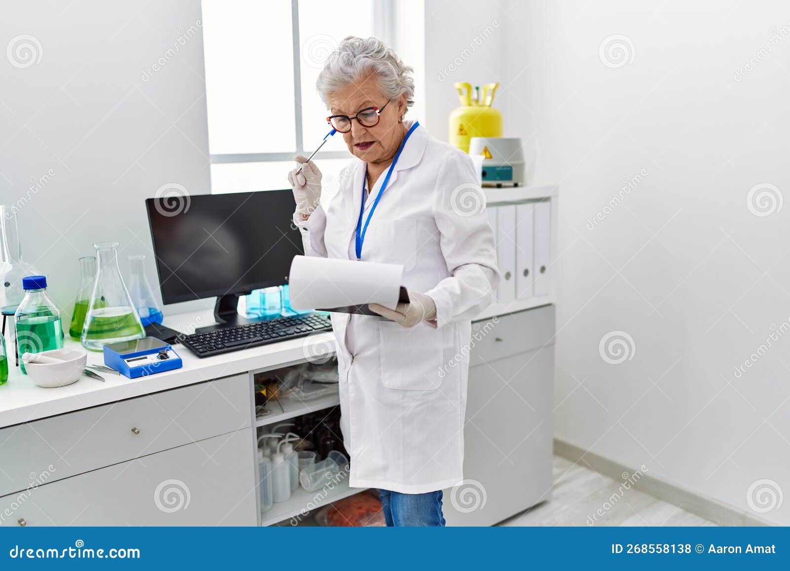 Senior Grey-haired Woman Wearing Scientist Uniform with Doubt ...