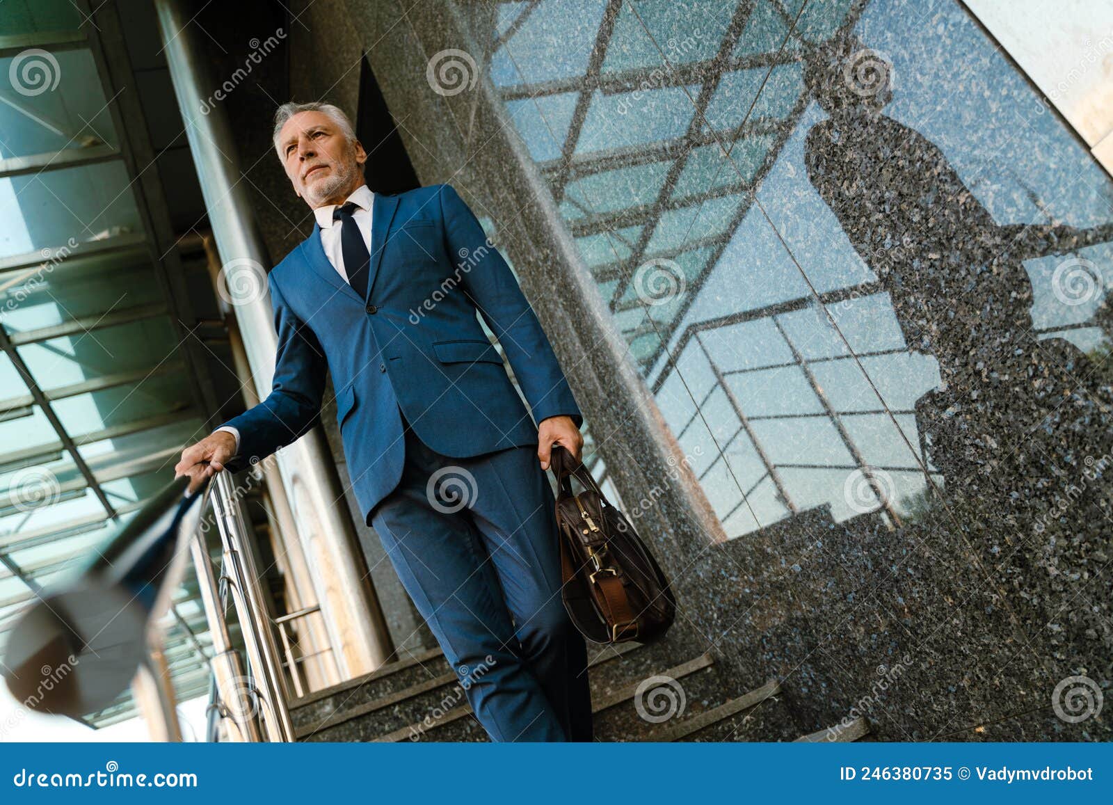 Senior Grey Man Dressed in Suit Going Down Stairs Stock Image - Image ...