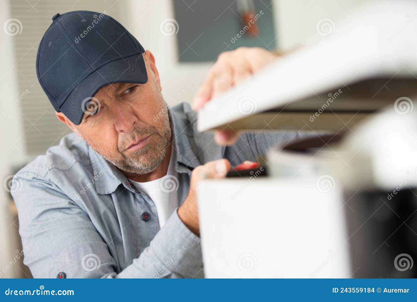 Senior Handyman Assembling Appliance Stock Photo - Image of inserting ...