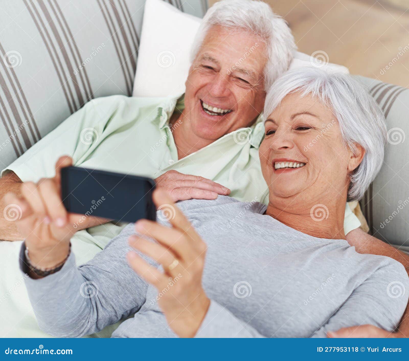 Senior Happy Couple And Relax For Selfie On Sofa In Living Room With