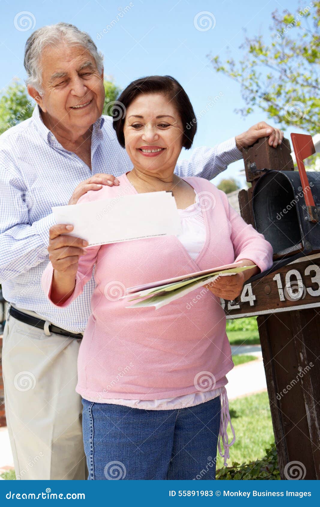 Senior Hispanic Couple Checking Mailbox Stock Image - Image of male, mail: 55891983