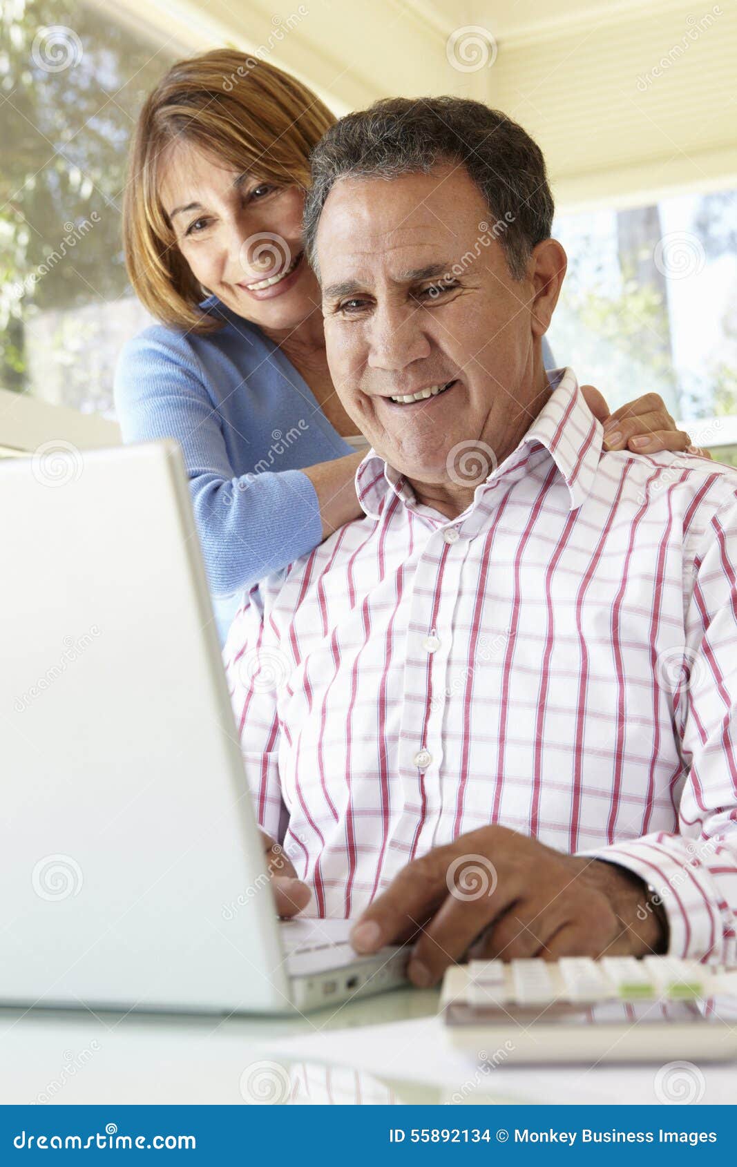Senior Hispanic Couple Using Laptop in Home Office Stock Photo - Image ...