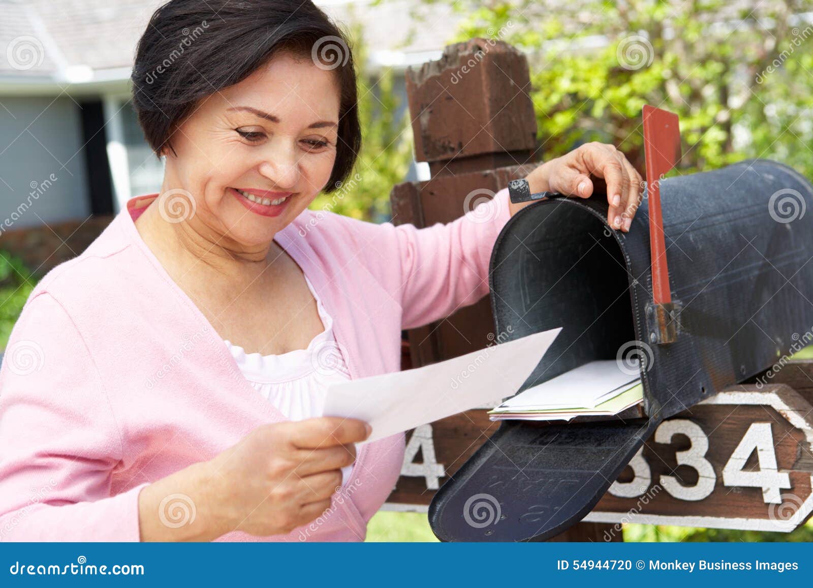 Senior Hispanic Woman Checking Mailbox Stock Photo - Image of reading ...