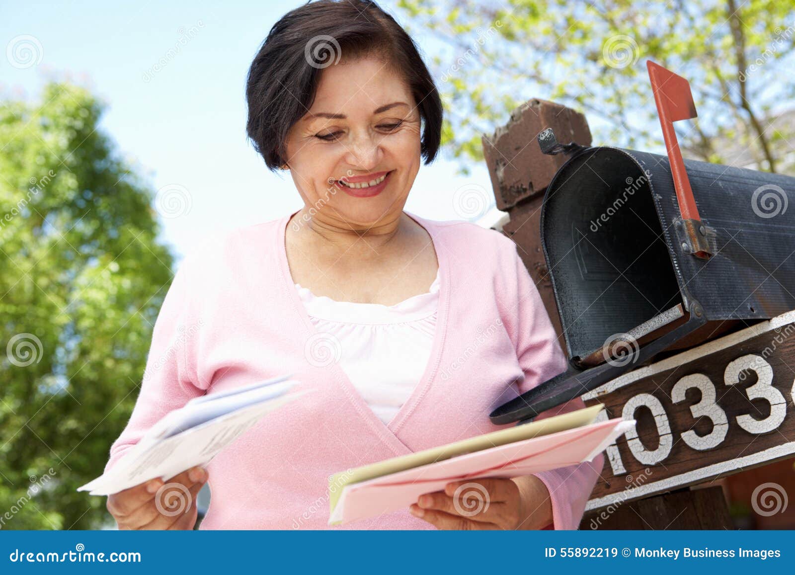 Senior Hispanic Woman Checking Mailbox Stock Image - Image of portrait ...
