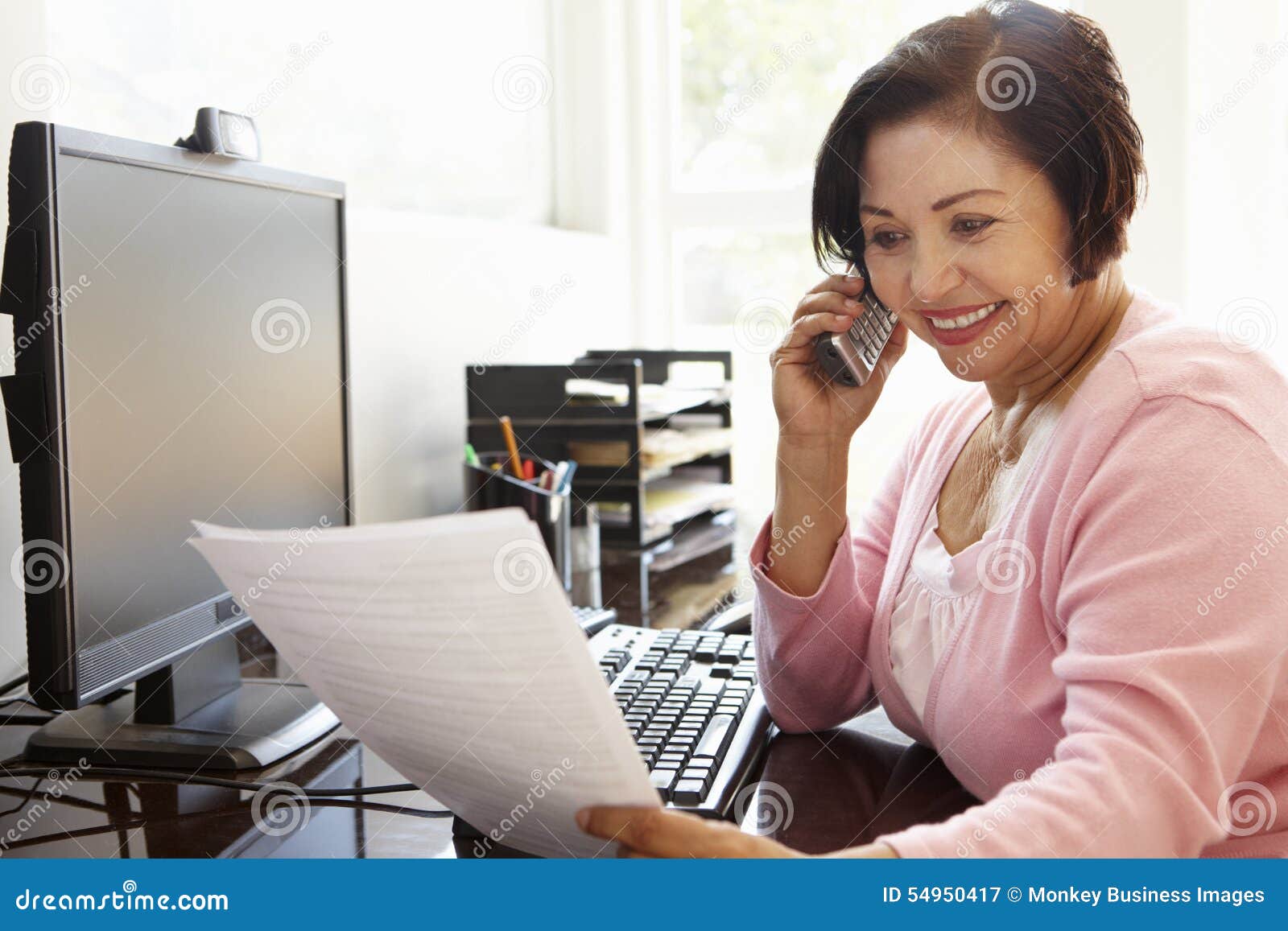 Senior Hispanic Woman Working on Computer at Home Stock Image - Image ...