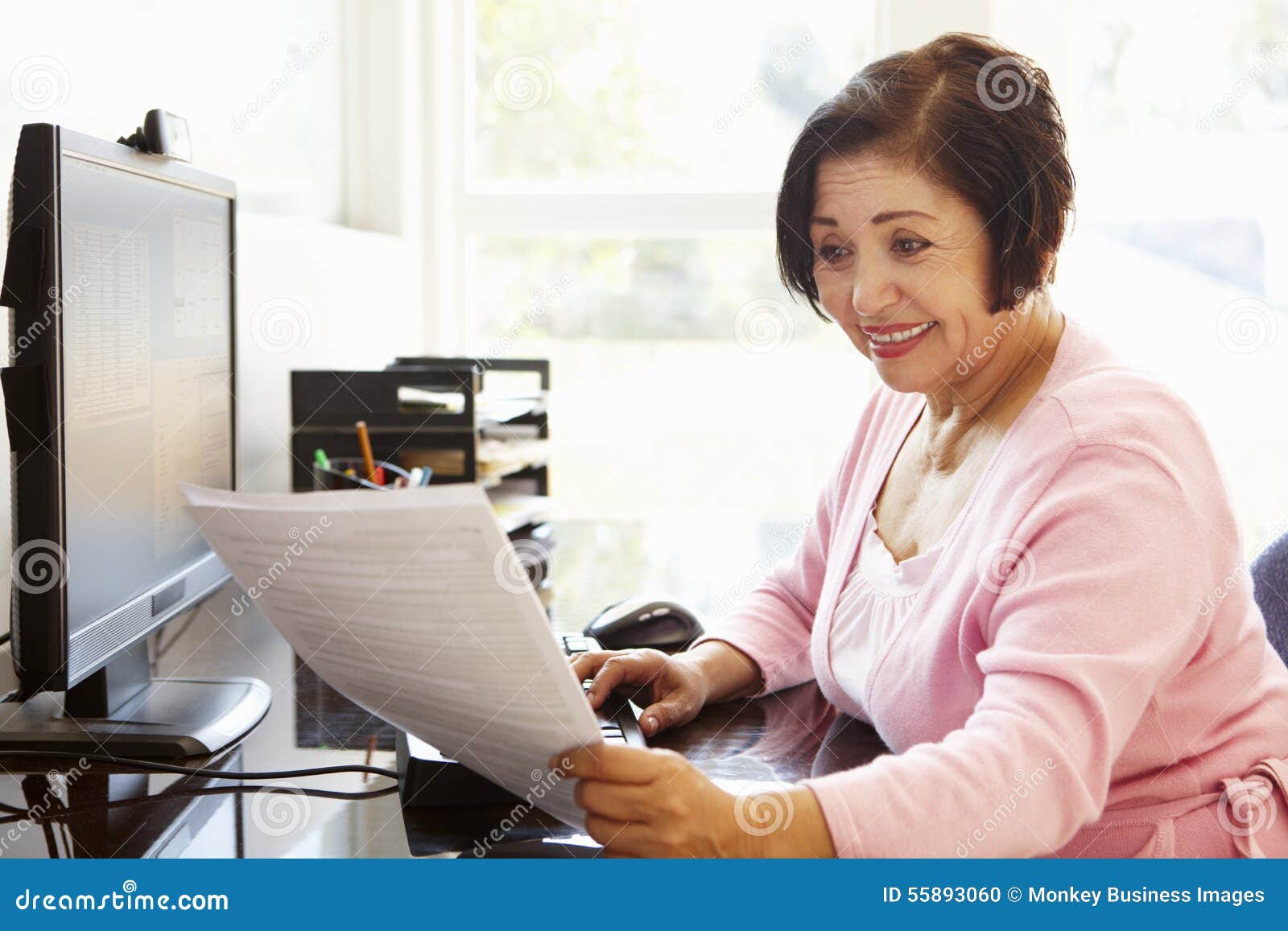 Senior Hispanic Woman Working on Computer at Home Stock Photo - Image ...