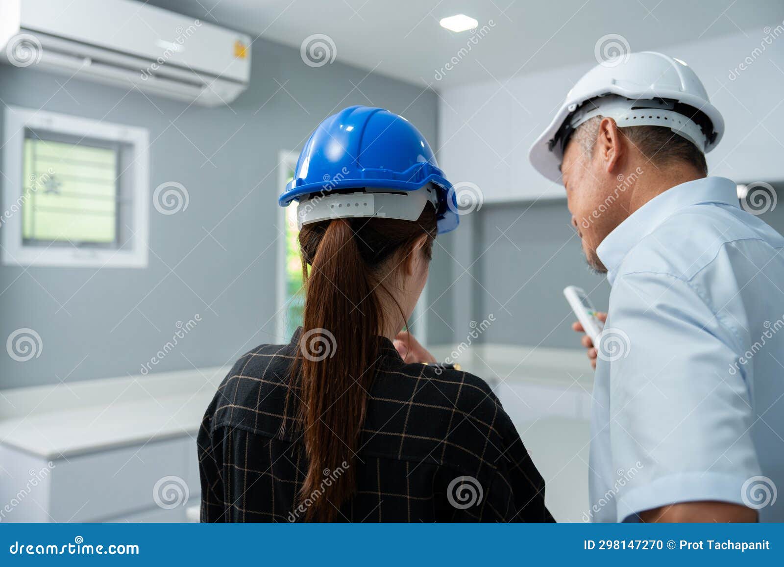 Senior Home Inspector Checking Home Defects and Teaching Young ...