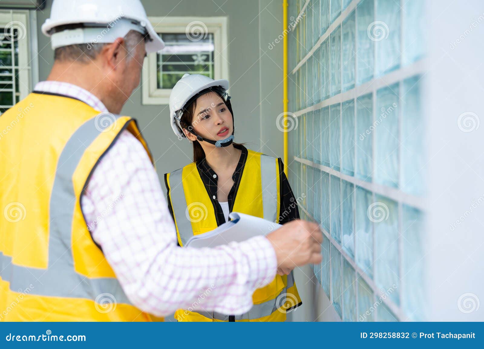 Senior Home Inspector Checking Home Defects and Teaching Young ...