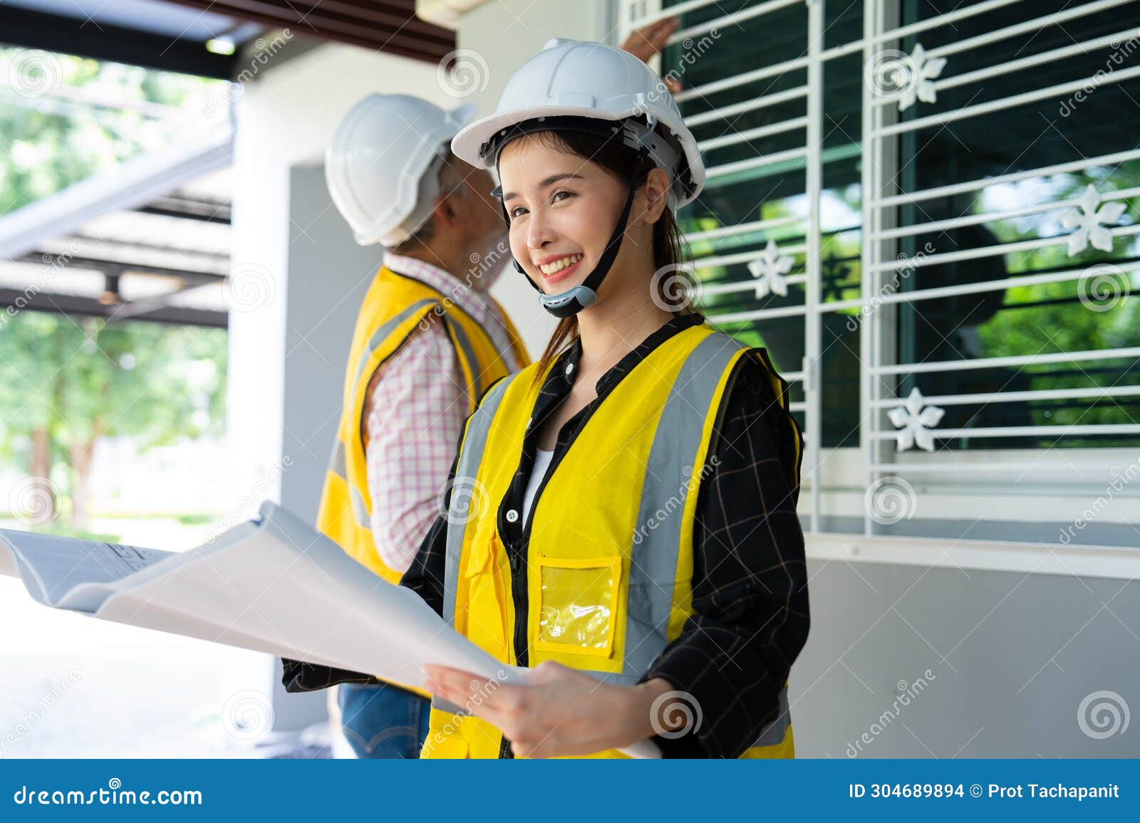 Senior Home Inspector Checking Home Defects and Teaching Young ...