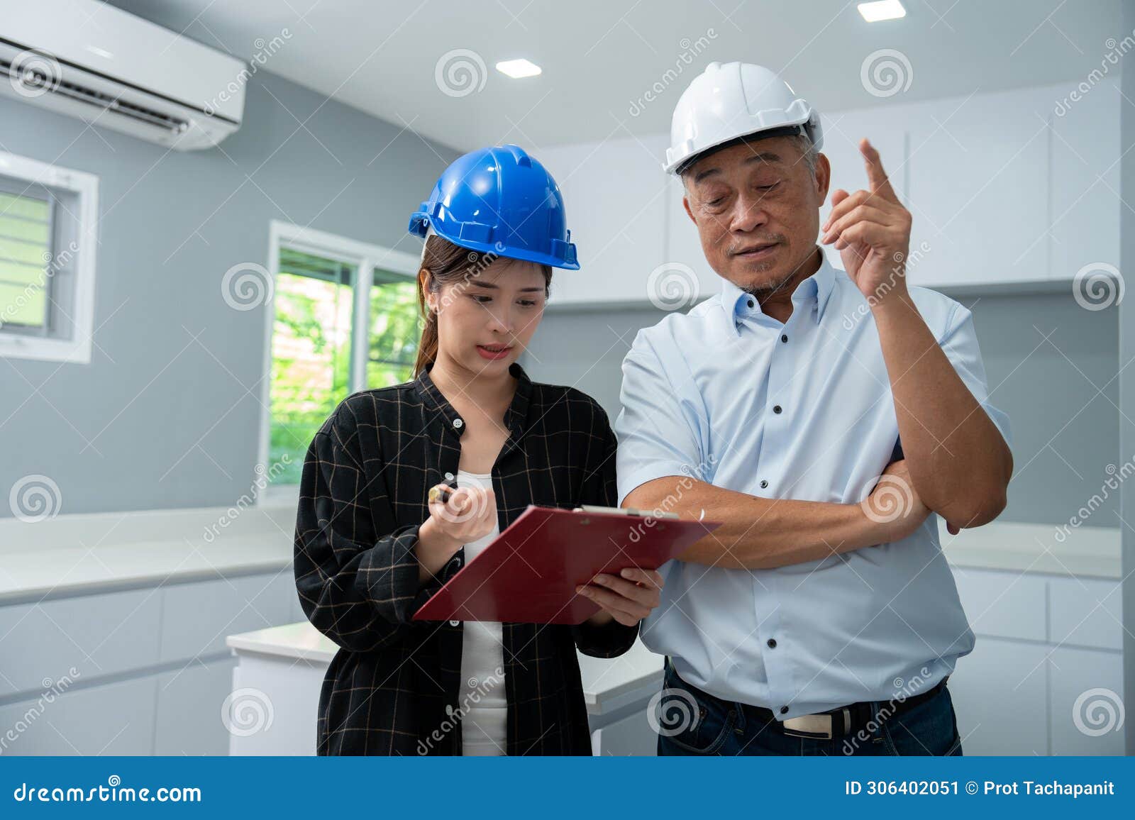 Senior Home Inspector Checking Home Defects and Teaching Young ...